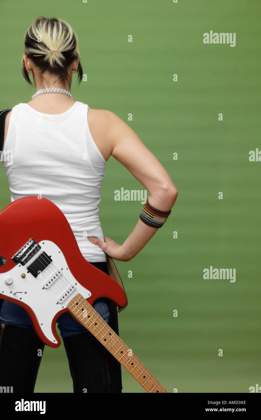 Back View of Woman with Electric Guitar Stock Photo - Alamy