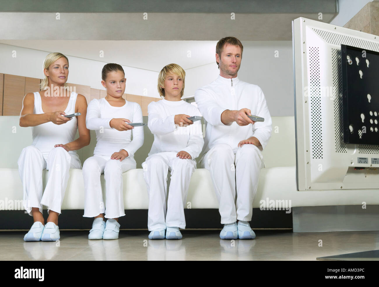 Tv remote control family serious hi-res stock photography and images ...