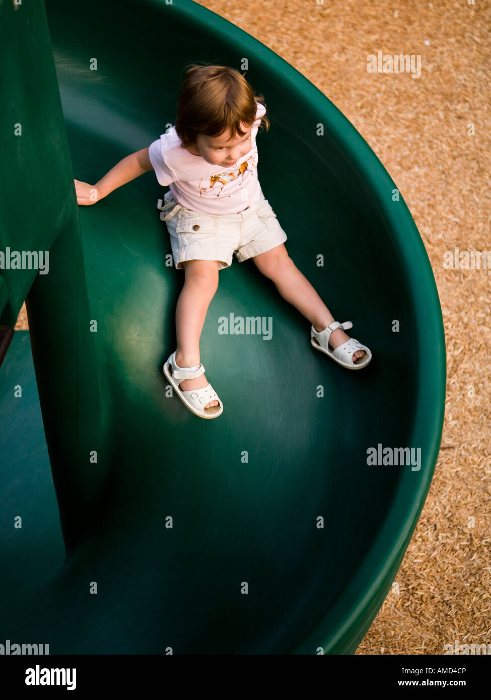 Girls play on slides hi-res stock photography and images - Alamy