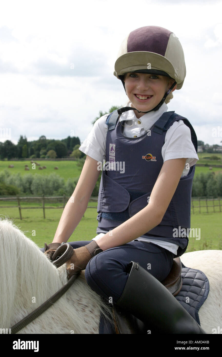 A young horse rider on her horse Stock Photo - Alamy