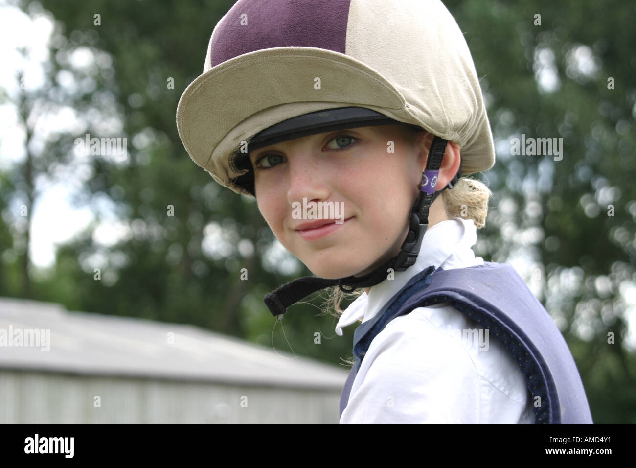 A close up photo of a girl wearing a helmet on her horse Stock Photo ...