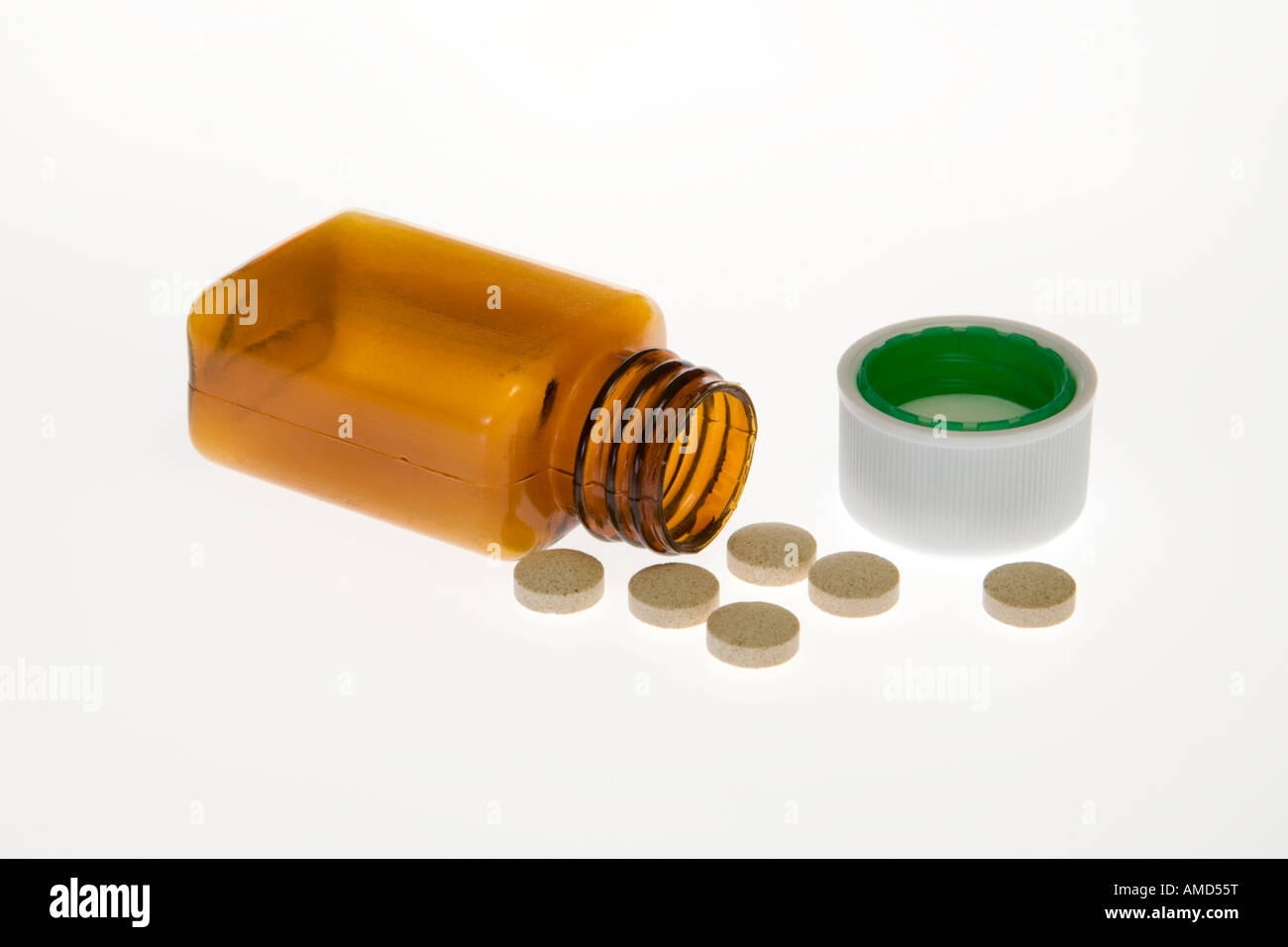 Pill bottle and pills higher angle Stock Photo - Alamy