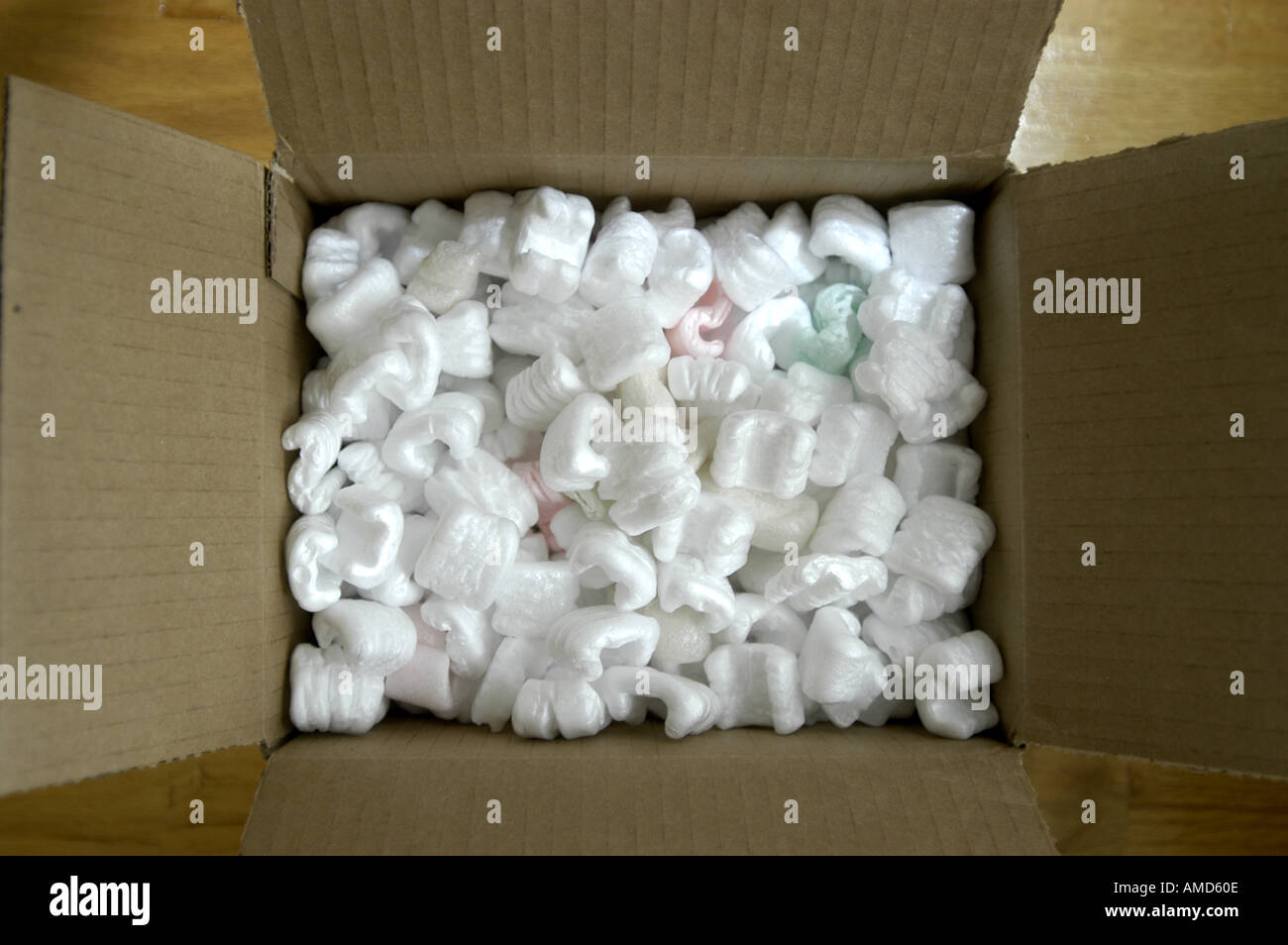 Open cardboard box styrofoam peanuts from above Stock Photo - Alamy