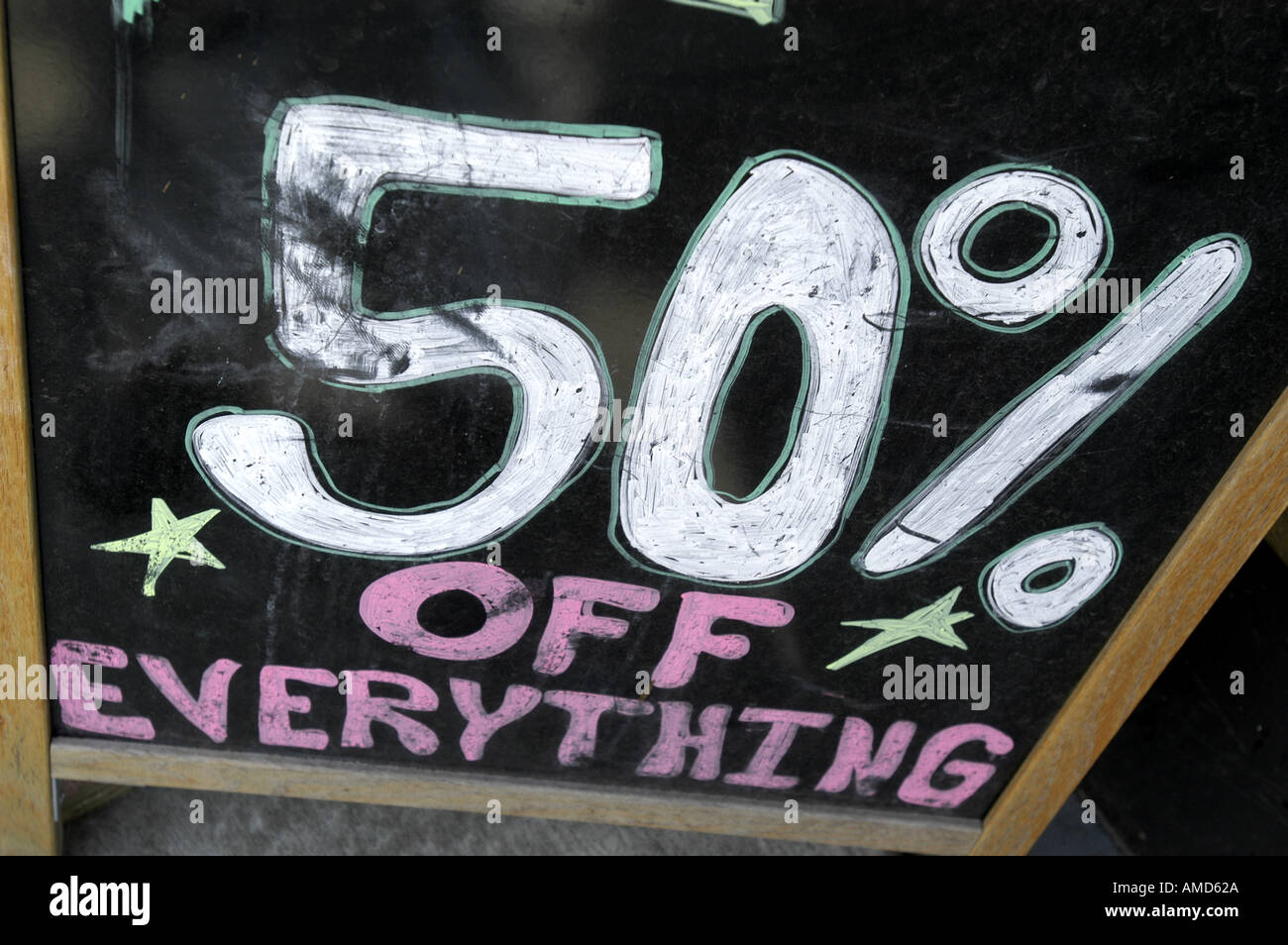 Black sign with white pink 50 off everything Stock Photo - Alamy