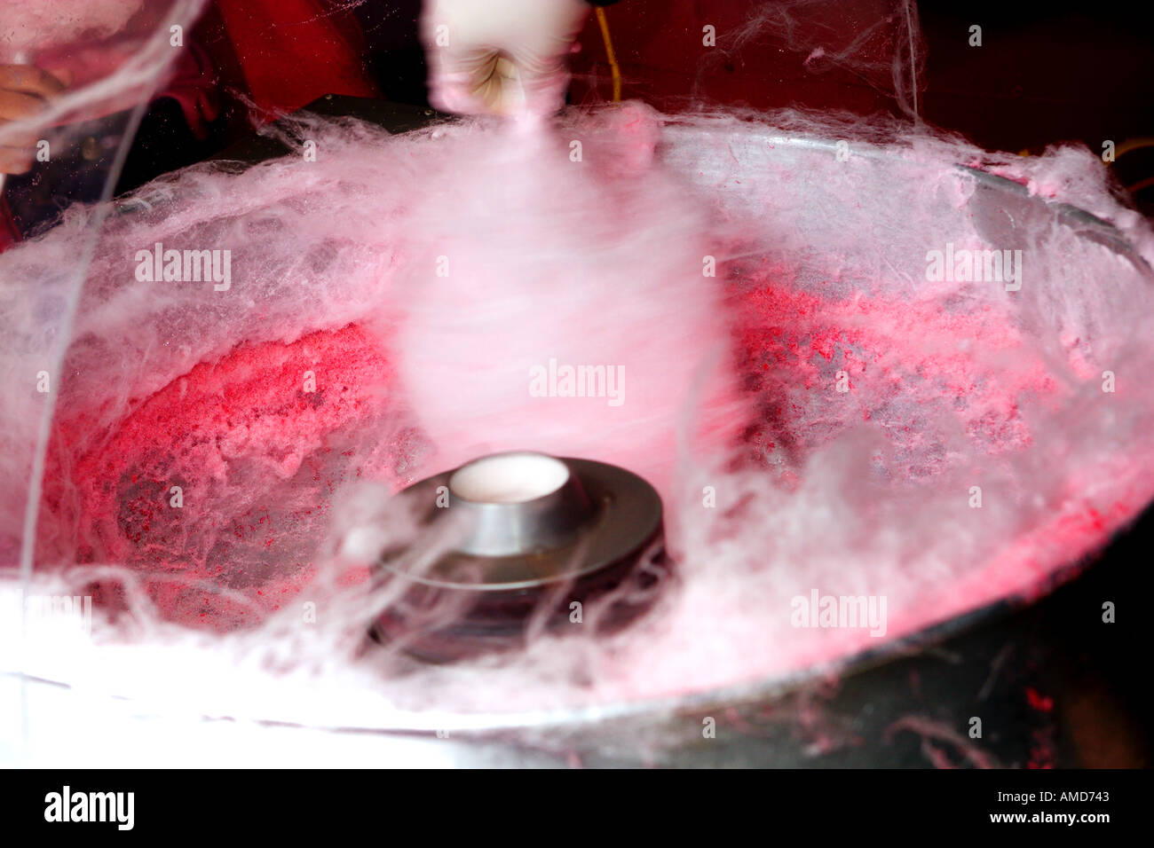 Cotton Candy being spun unto a paper cone Stock Photo - Alamy
