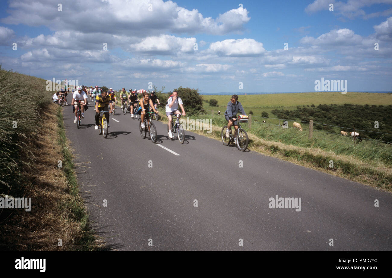 Cyclists on London to Brighton Bike Ride cycling on country lane at top ...