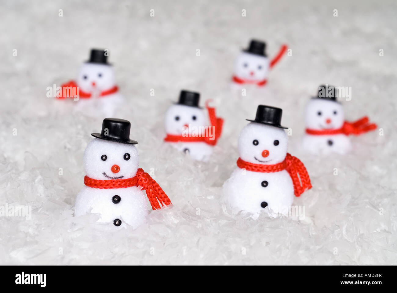 Hiking snowmen make their way through a snowy wilderness preparing for ...
