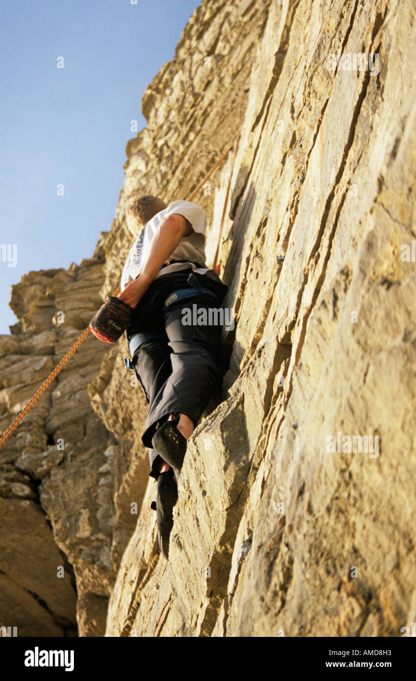Rock Climber on "Dancing Ledge" limestone cliff Langton Matravers ...