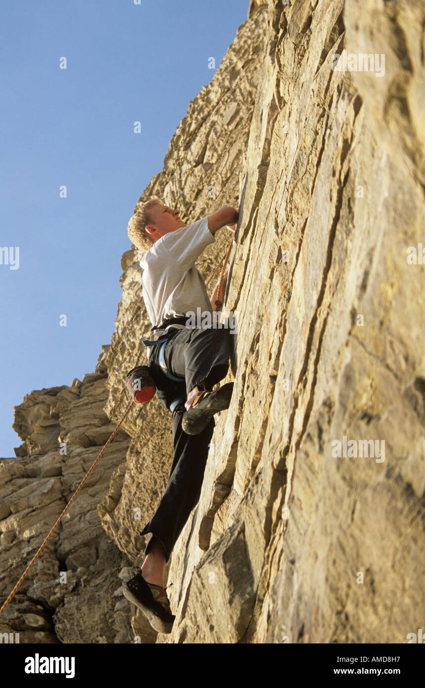 Rock Climber on "Dancing Ledge" limestone cliff Langton Matravers ...
