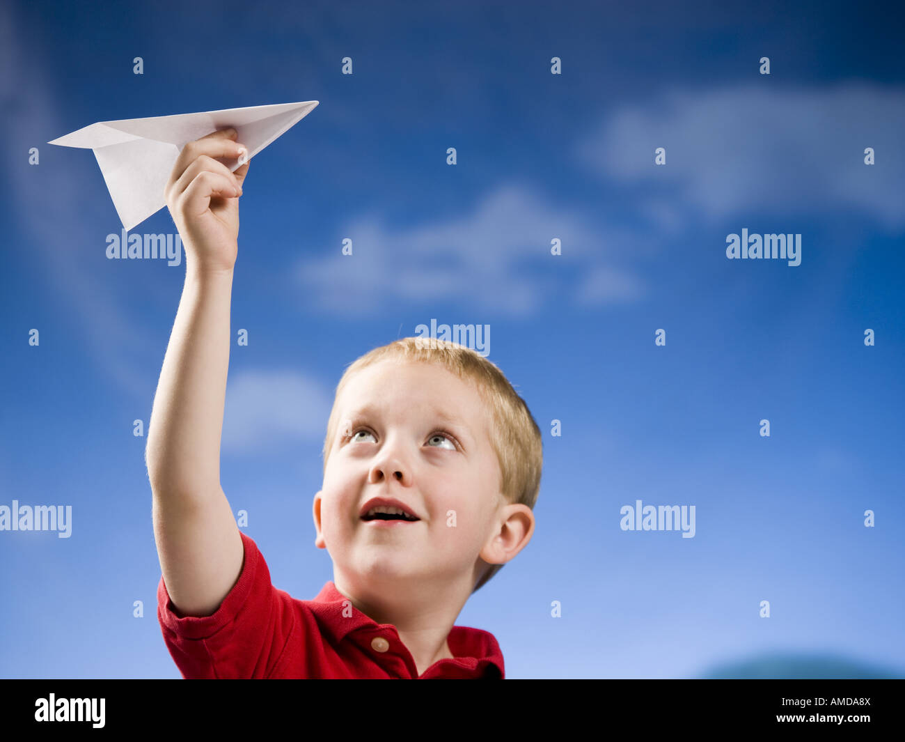 Boy with paper airplane outdoors Stock Photo - Alamy