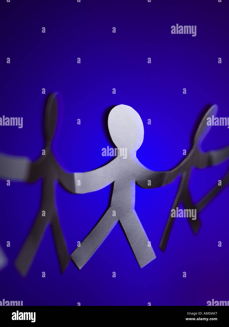 Three paper people cutouts Stock Photo - Alamy