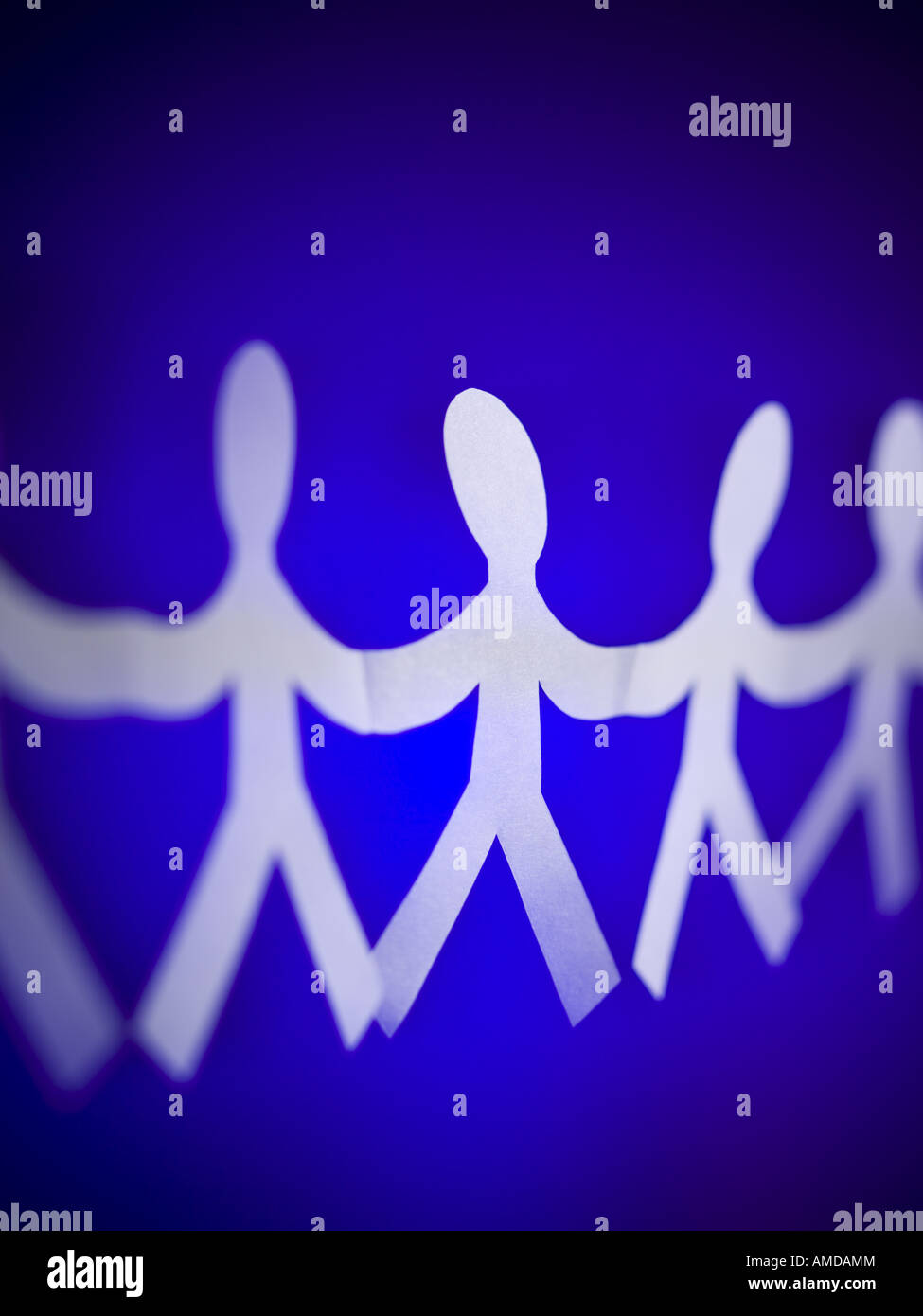 Five paper people cutouts Stock Photo - Alamy