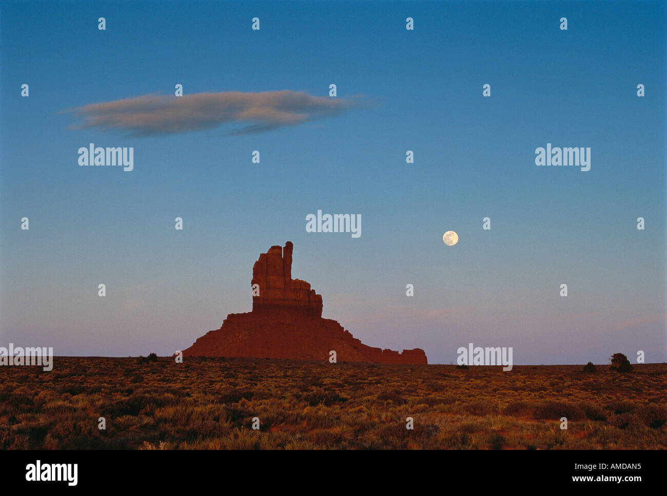 Overview of Rock Formation and Full Moon, Monument Valley, Arizona, USA ...