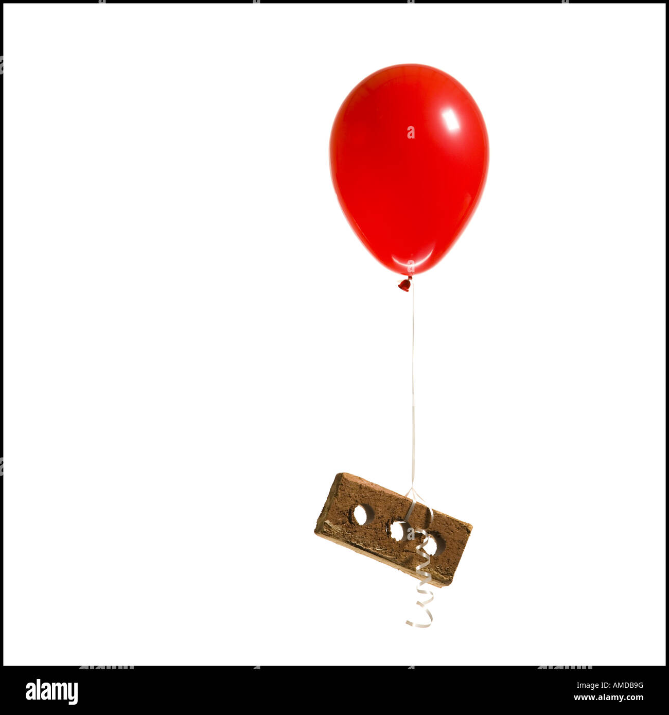 Helium balloon lifting brick Stock Photo - Alamy