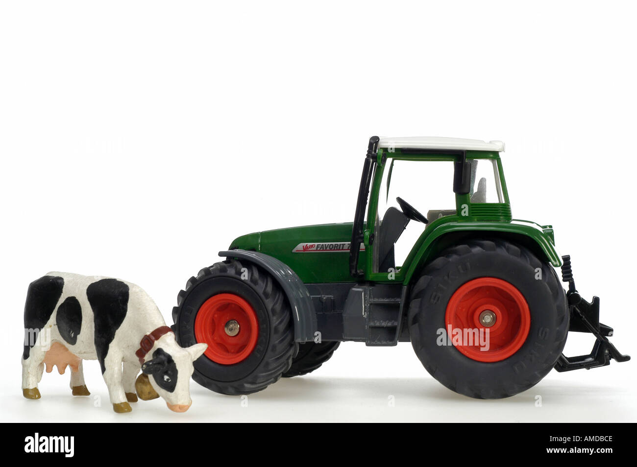tractor and cow Stock Photo - Alamy
