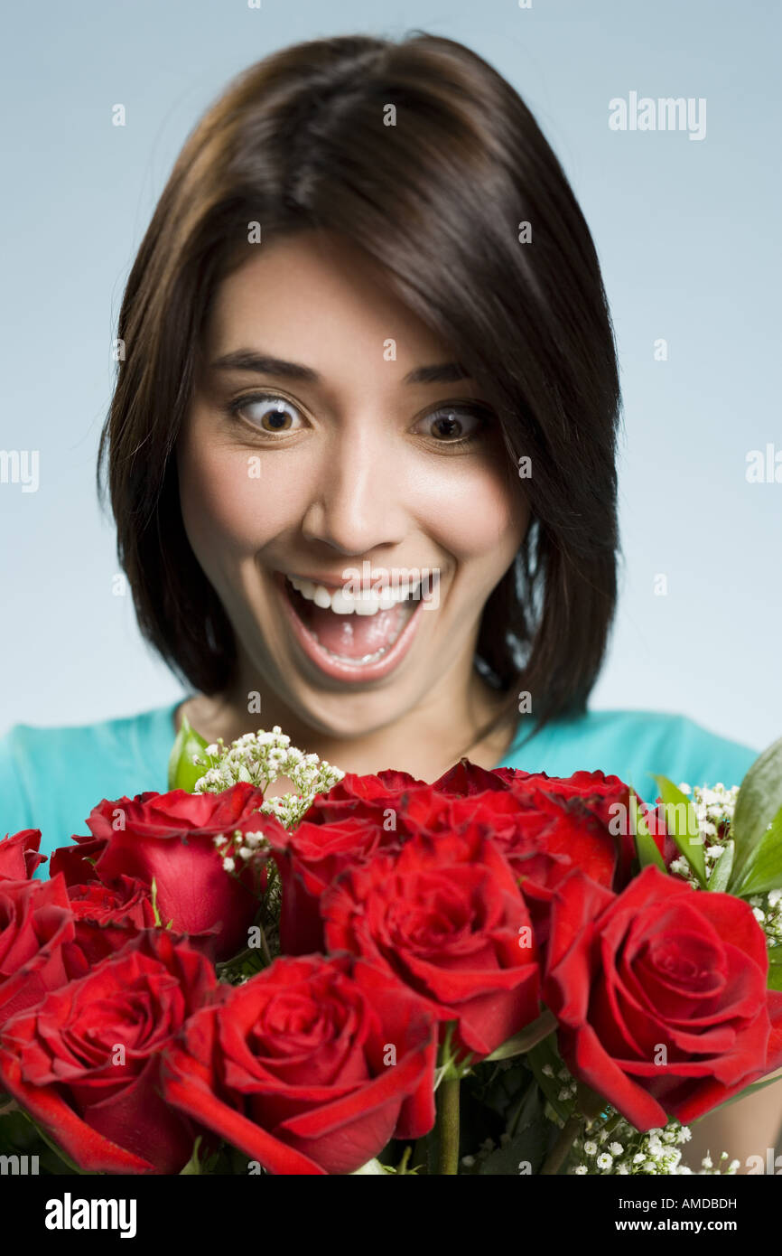 Excited woman with red roses Stock Photo - Alamy