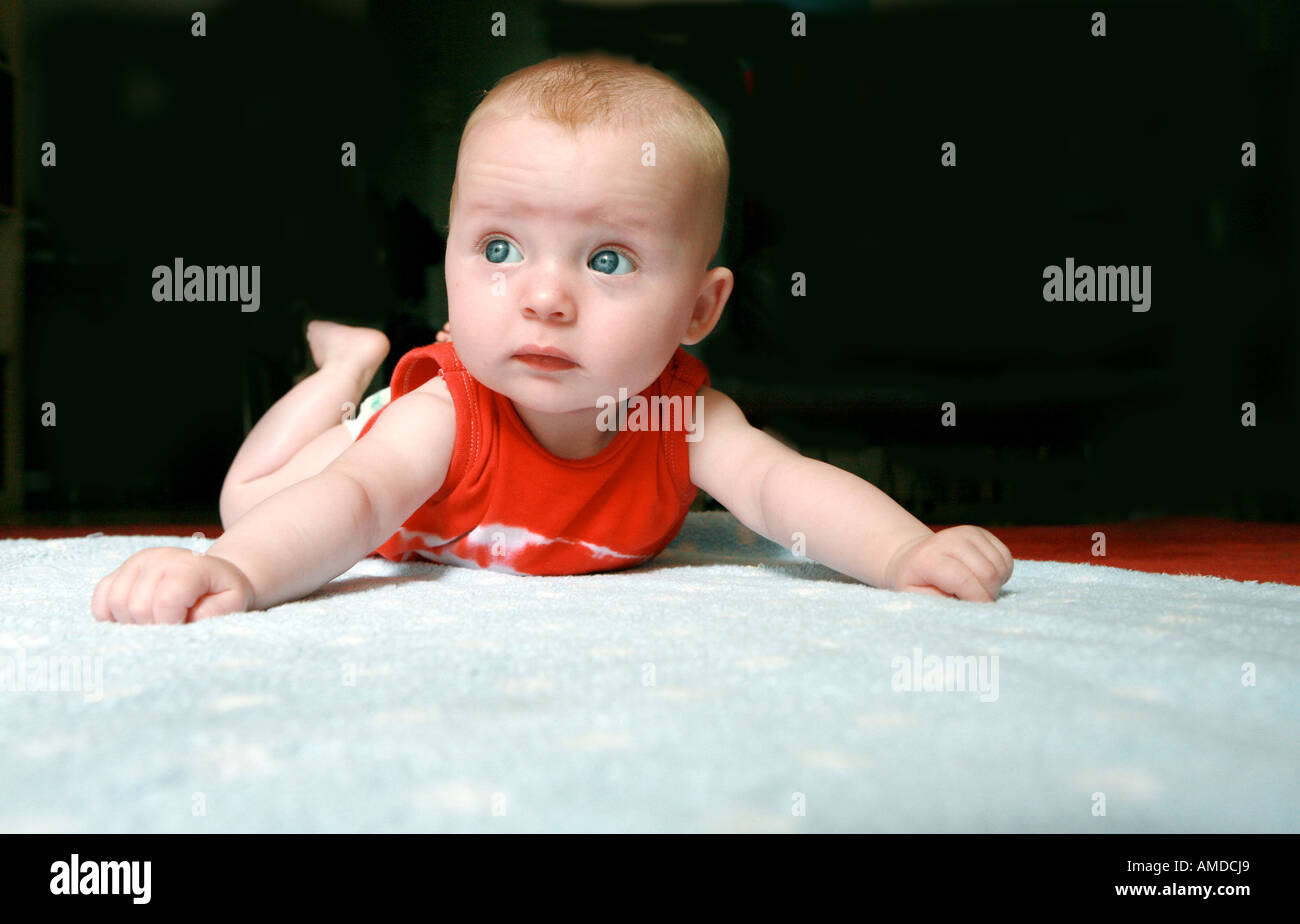 Baby On Rug Stock Photo - Alamy
