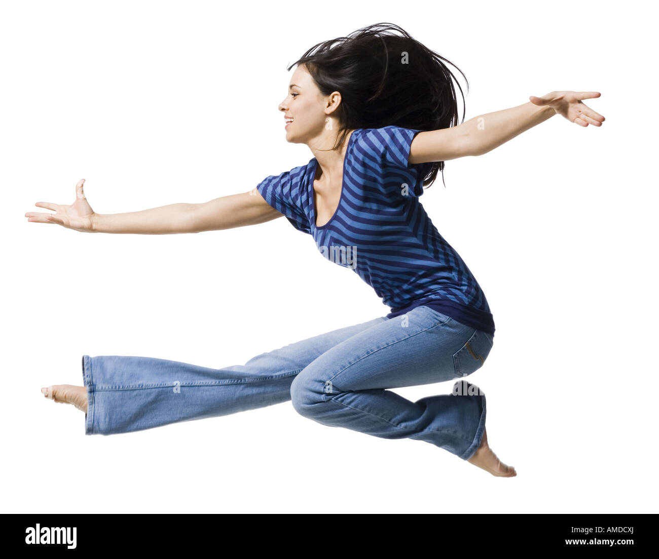 Woman jumping profile Stock Photo - Alamy