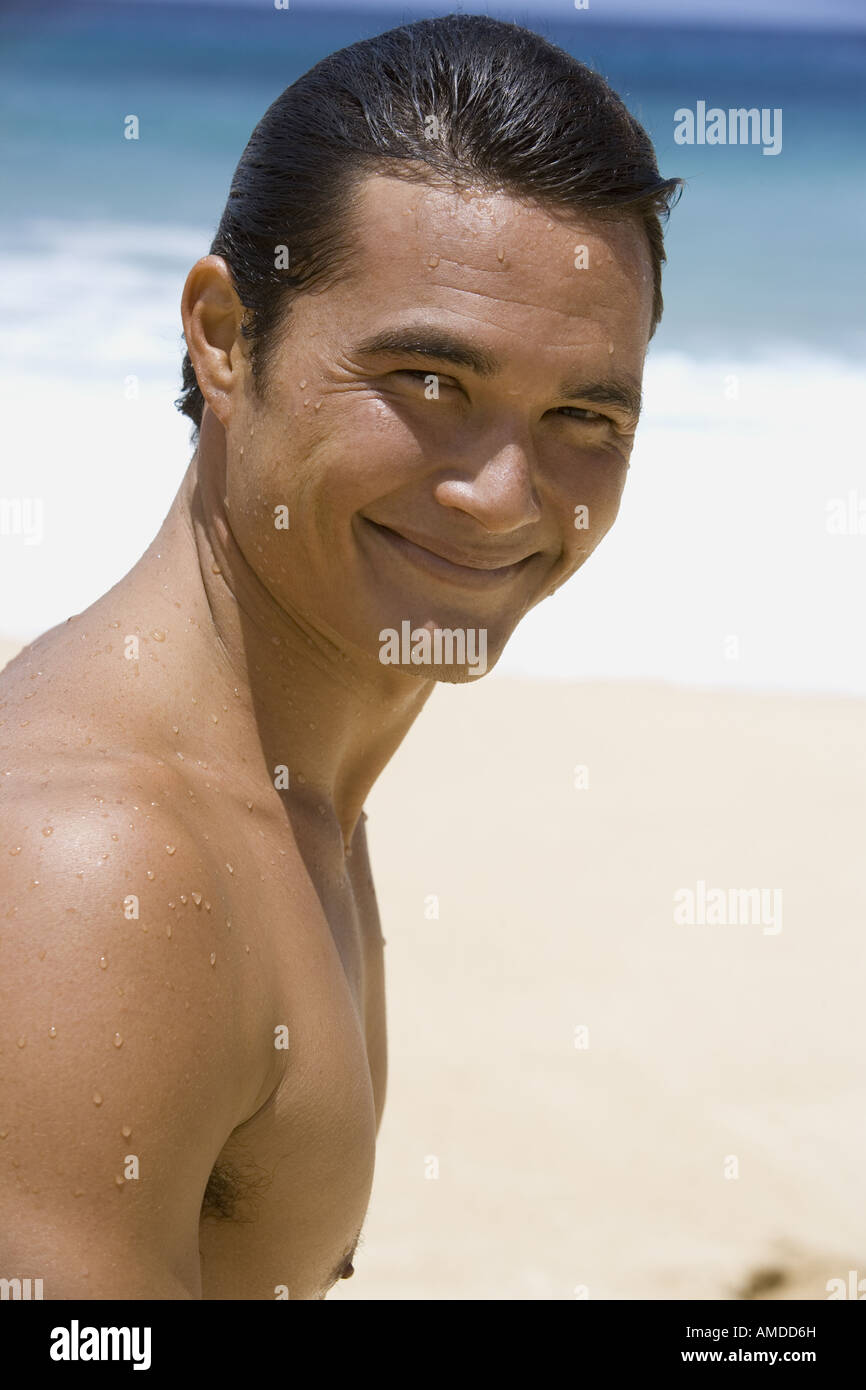 Man at beach smiling Stock Photo - Alamy