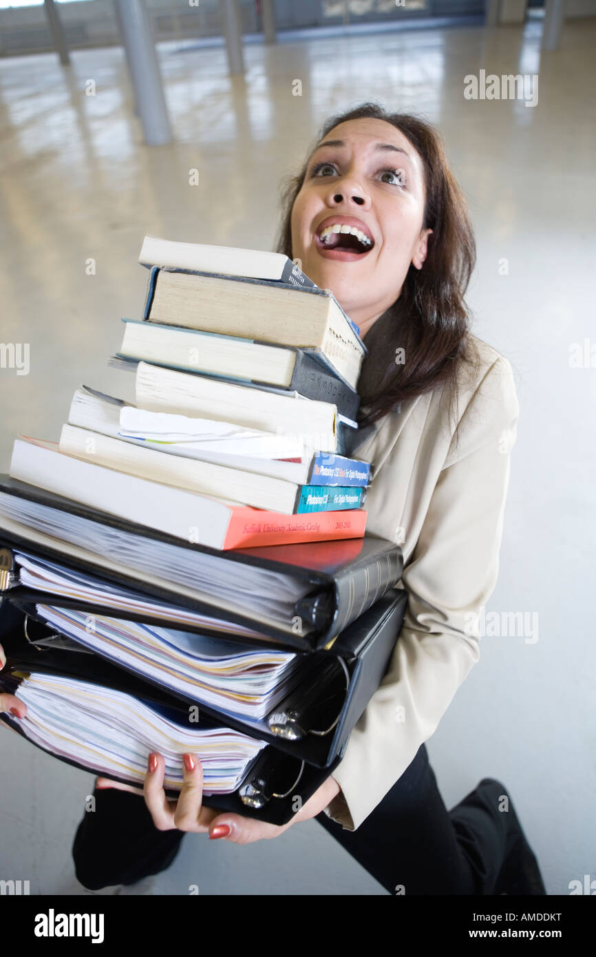 Business woman balancing the files while falling Stock Photo - Alamy