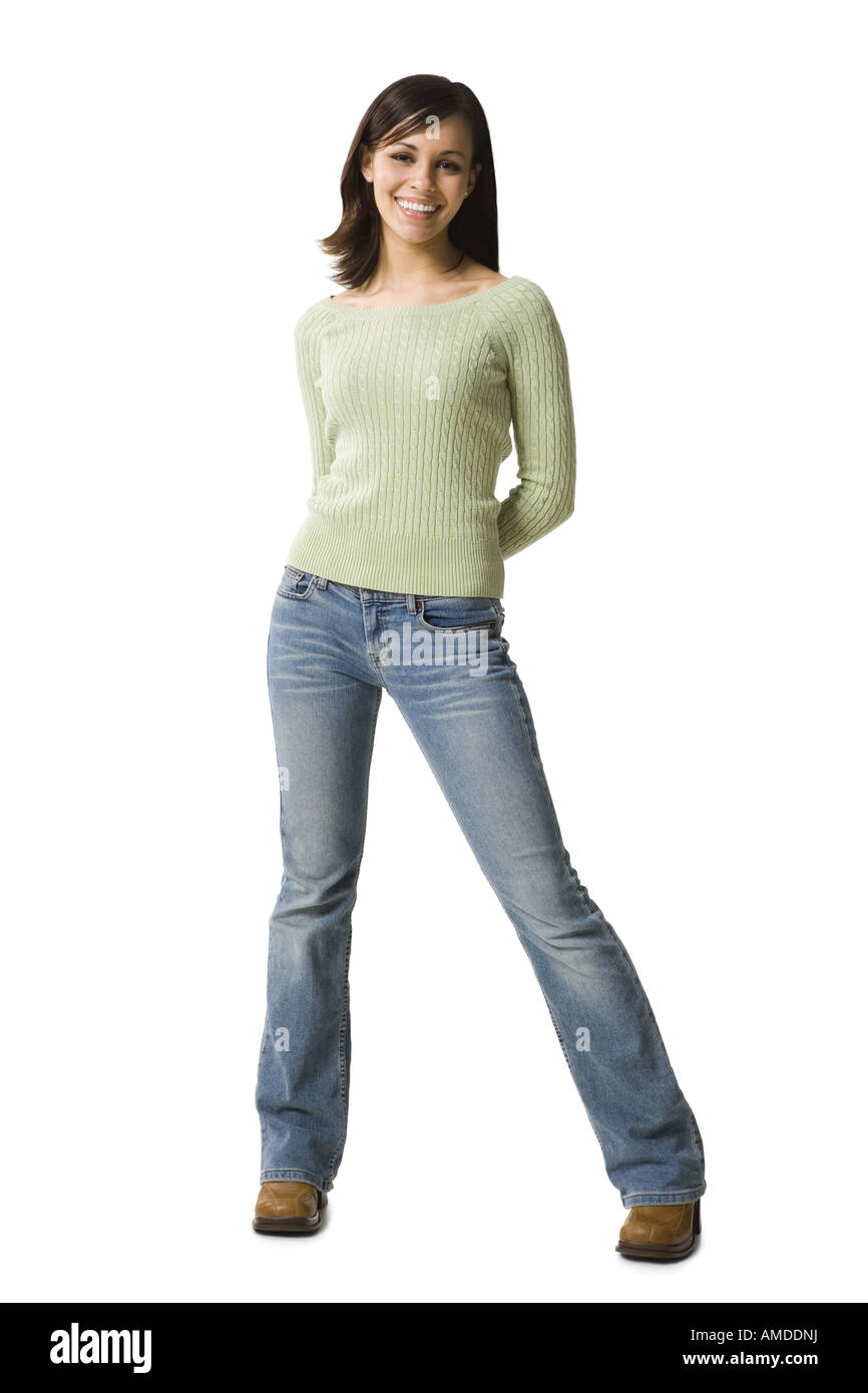 Woman standing and smiling Stock Photo - Alamy