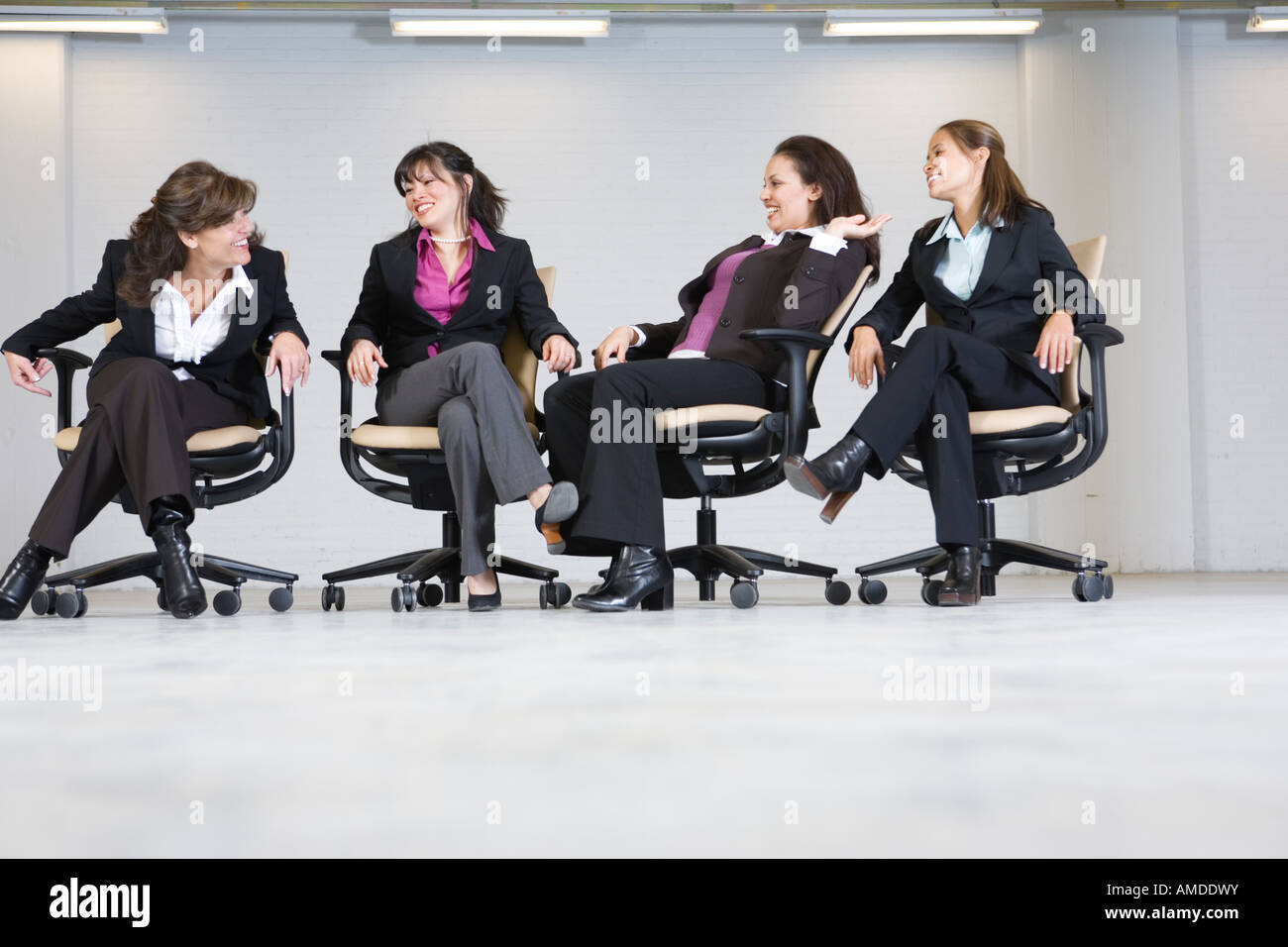 Business women laughing in office Stock Photo - Alamy