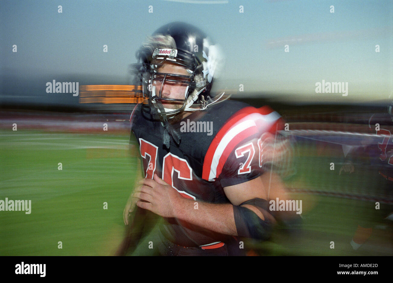 High school football player running Stock Photo - Alamy