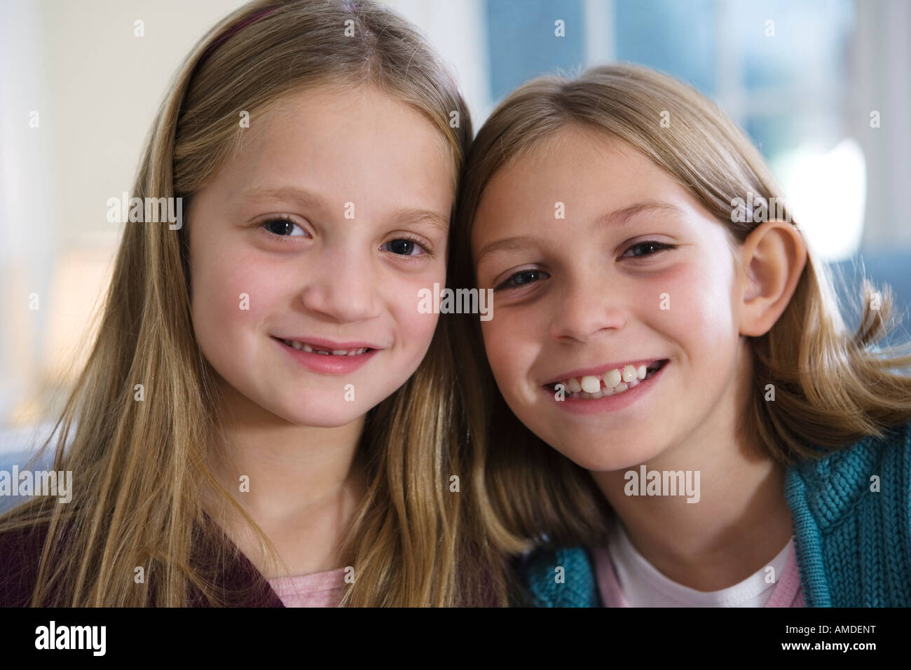 Portrait of two girls smiling Stock Photo - Alamy