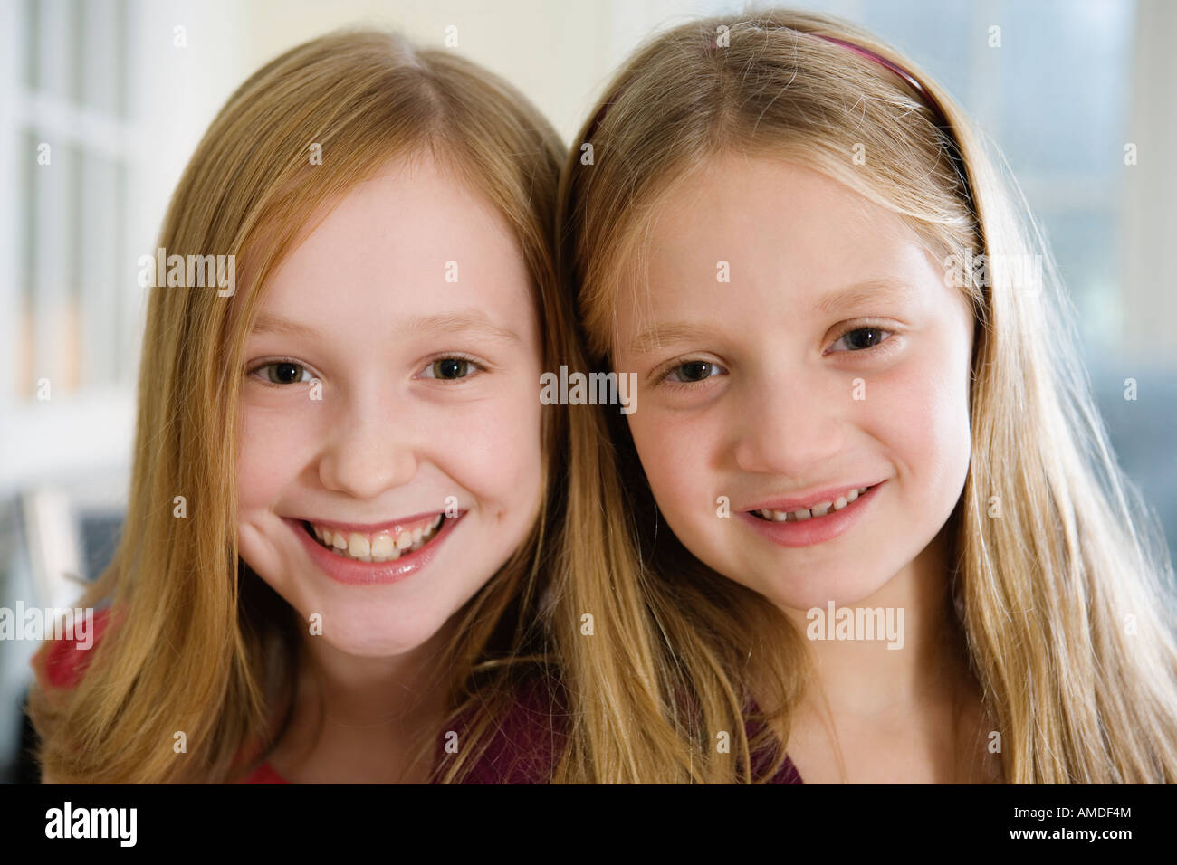 Portrait of two sisters smiling Stock Photo - Alamy