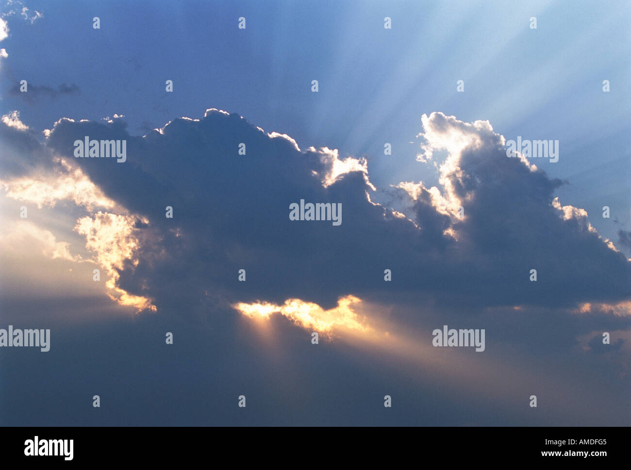 Sunrays through Clouds in Sky Stock Photo - Alamy
