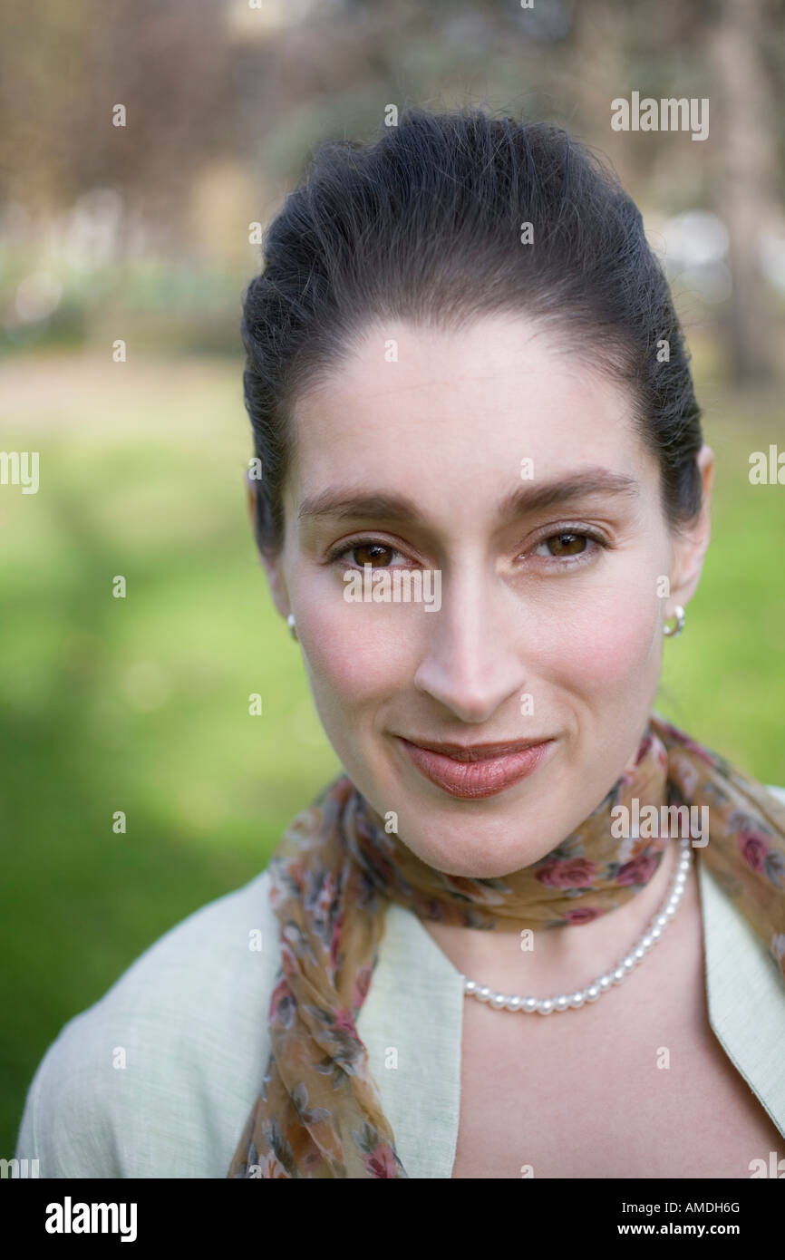 Portrait of a young woman smiling Stock Photo - Alamy