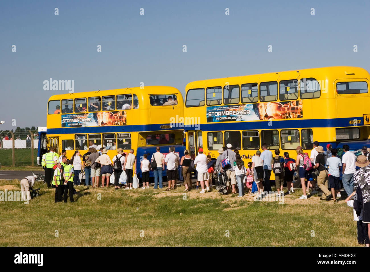 Queue of passengers boarding a double decker bus Stock Photo - Alamy