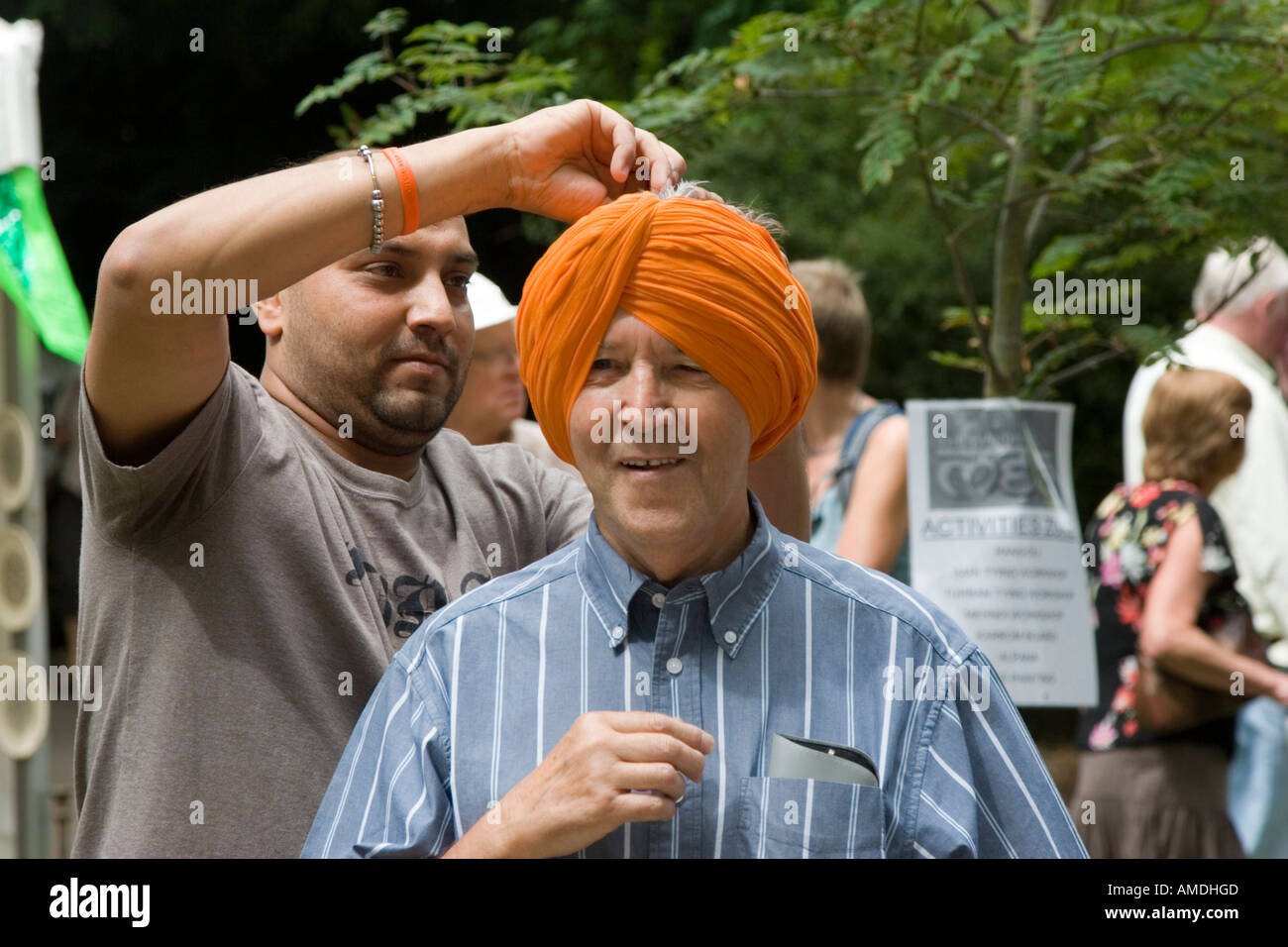 Portrait of man tying his turban hi-res stock photography and images ...