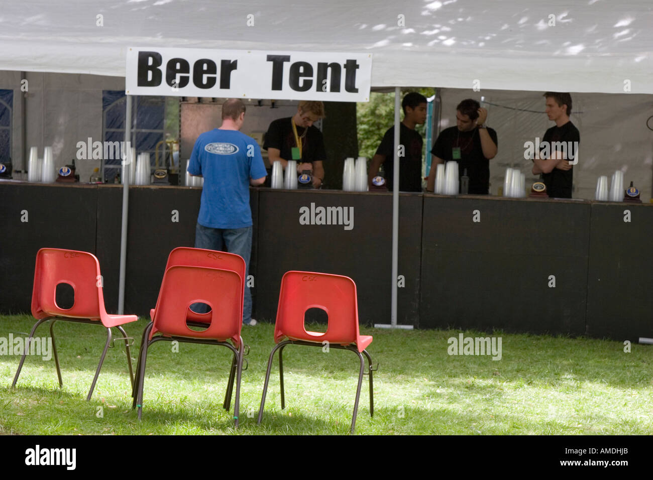 Lone drinker at the beer tent Stock Photo - Alamy