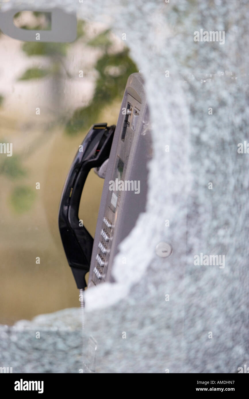 Smashed and vandalised telephone box Stock Photo - Alamy