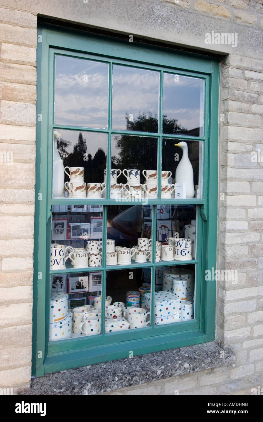 China cups and plates on display in shop window Stock Photo - Alamy