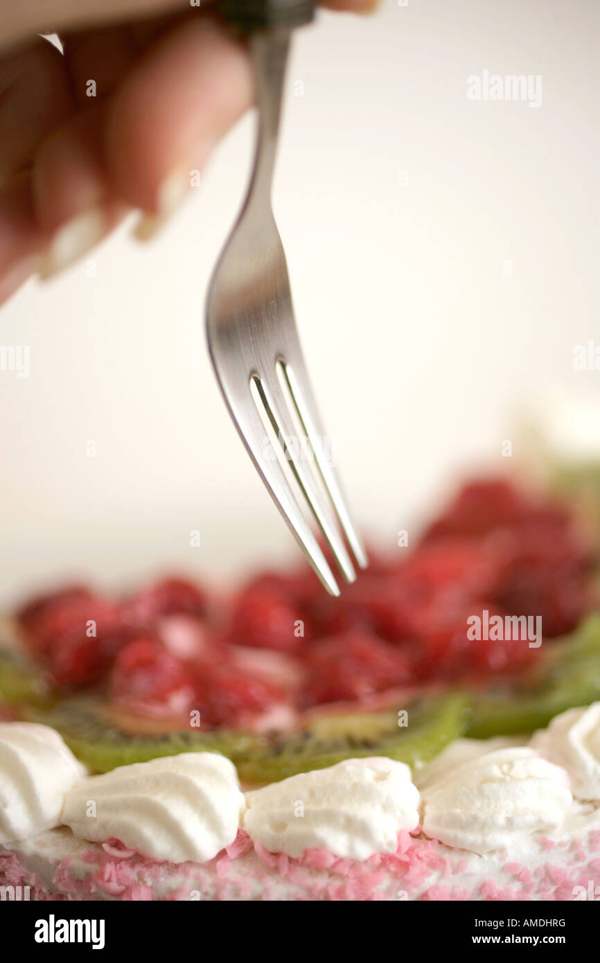 Tucking into cake Stock Photo - Alamy