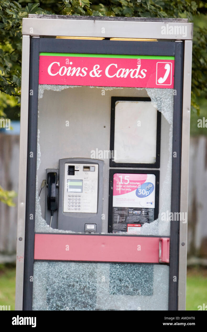 Smashed and vandalised telephone box Stock Photo - Alamy