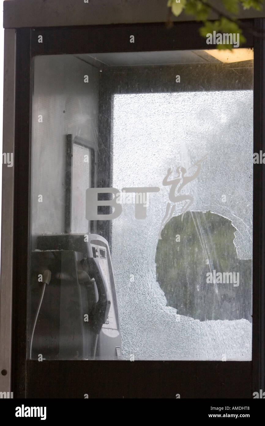 Smashed and vandalised telephone box Stock Photo - Alamy