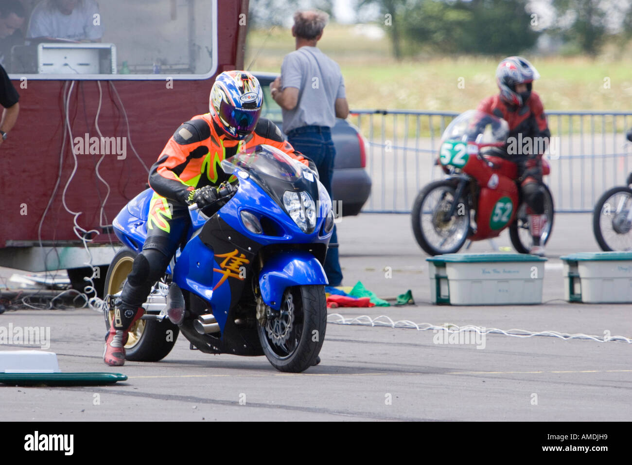 Racing vintage motorcycles on old airfield runway Stock Photo - Alamy