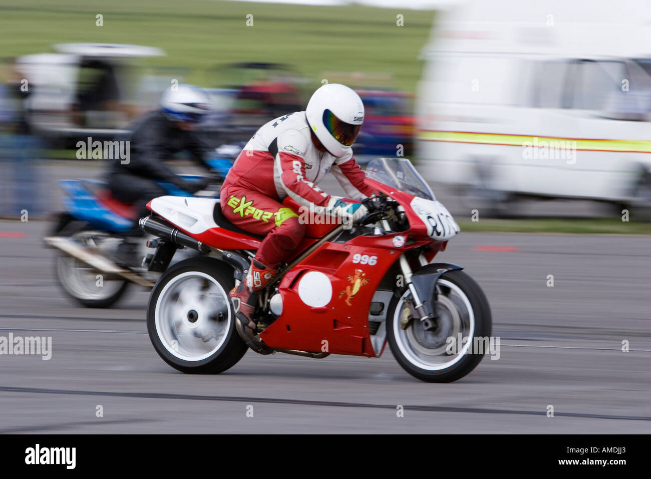 Racing vintage motorcycles on old airfield runway Stock Photo - Alamy