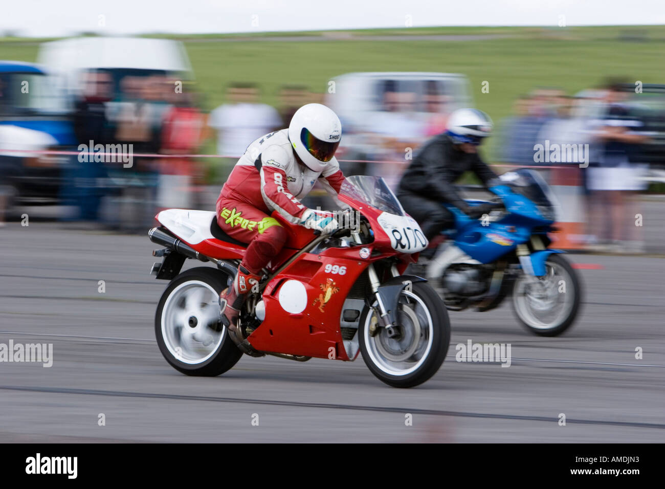 Racing vintage motorcycles on old airfield runway Stock Photo - Alamy