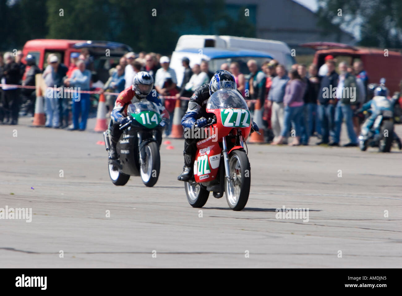 Racing vintage motorcycles on old airfield runway Stock Photo - Alamy