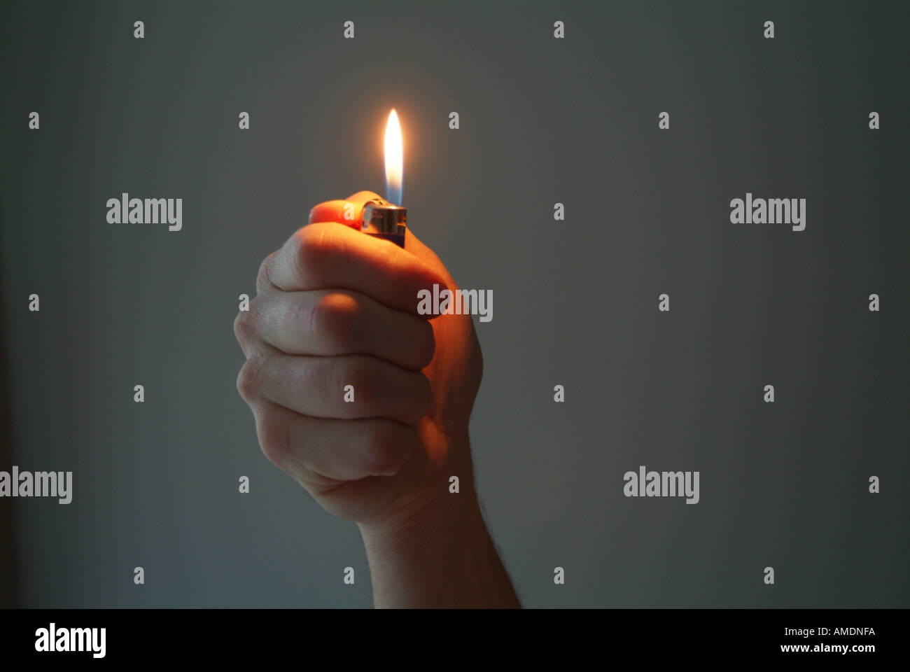 Hand holding lit lighter cigarette lighter hi-res stock photography and ...