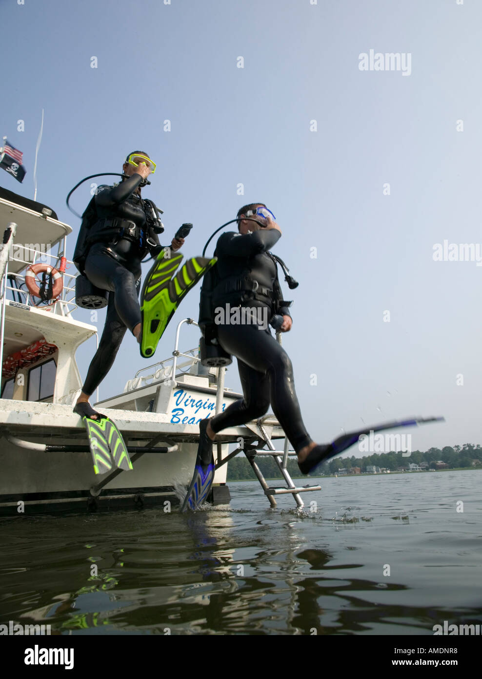 Giant stride entry from dive boat Miss Lauren Stock Photo - Alamy
