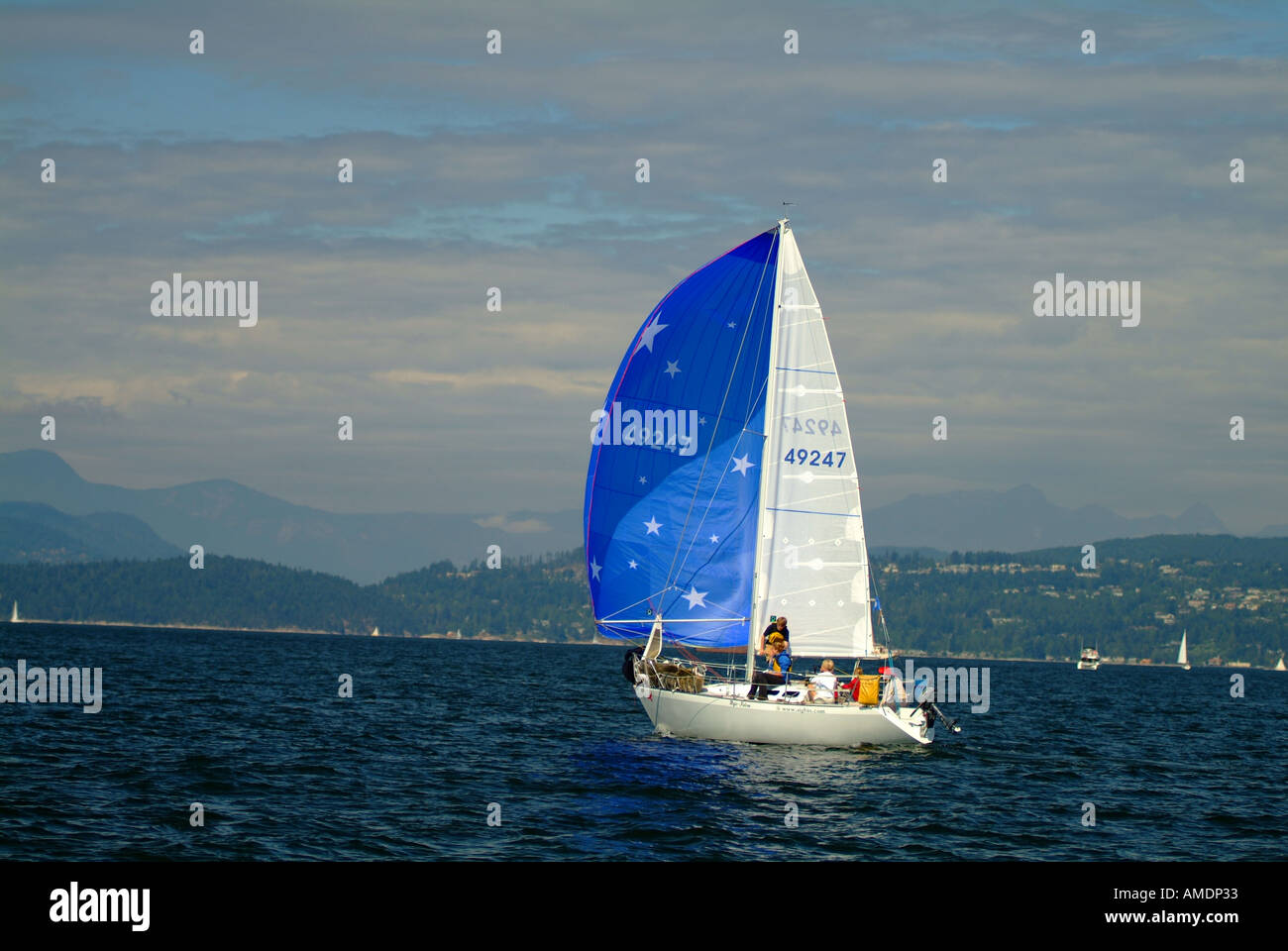 Sailing boat yacht with spinnaker set up Stock Photo - Alamy