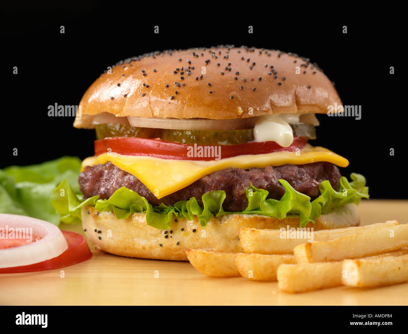 Cheeseburger lettuce beef patty tomato slice cheese roll hi-res stock ...