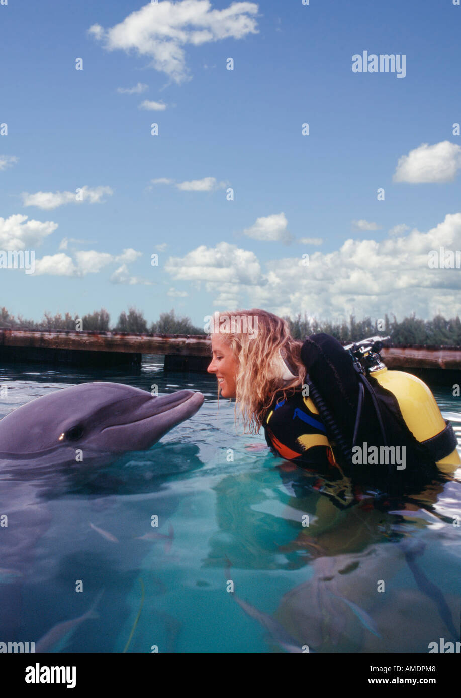 Dolphin kissing woman hi-res stock photography and images - Alamy