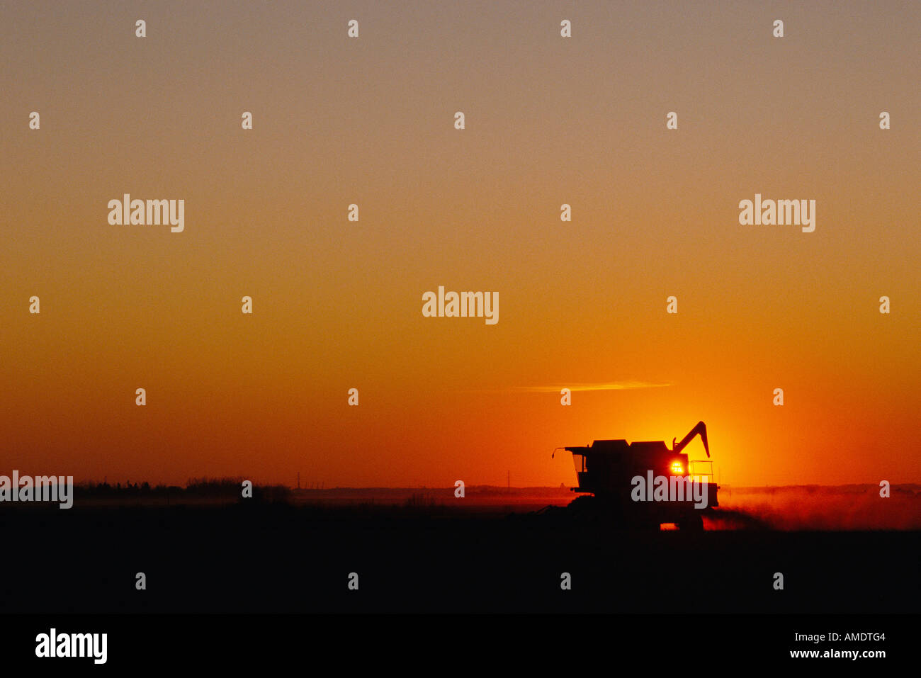 Silhouette of Combine at Sunset Alberta, Canada Stock Photo - Alamy