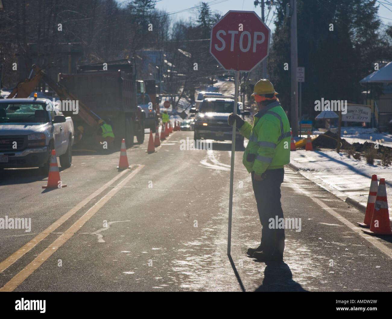 Worker holding a stop sign Stock Photo - Alamy